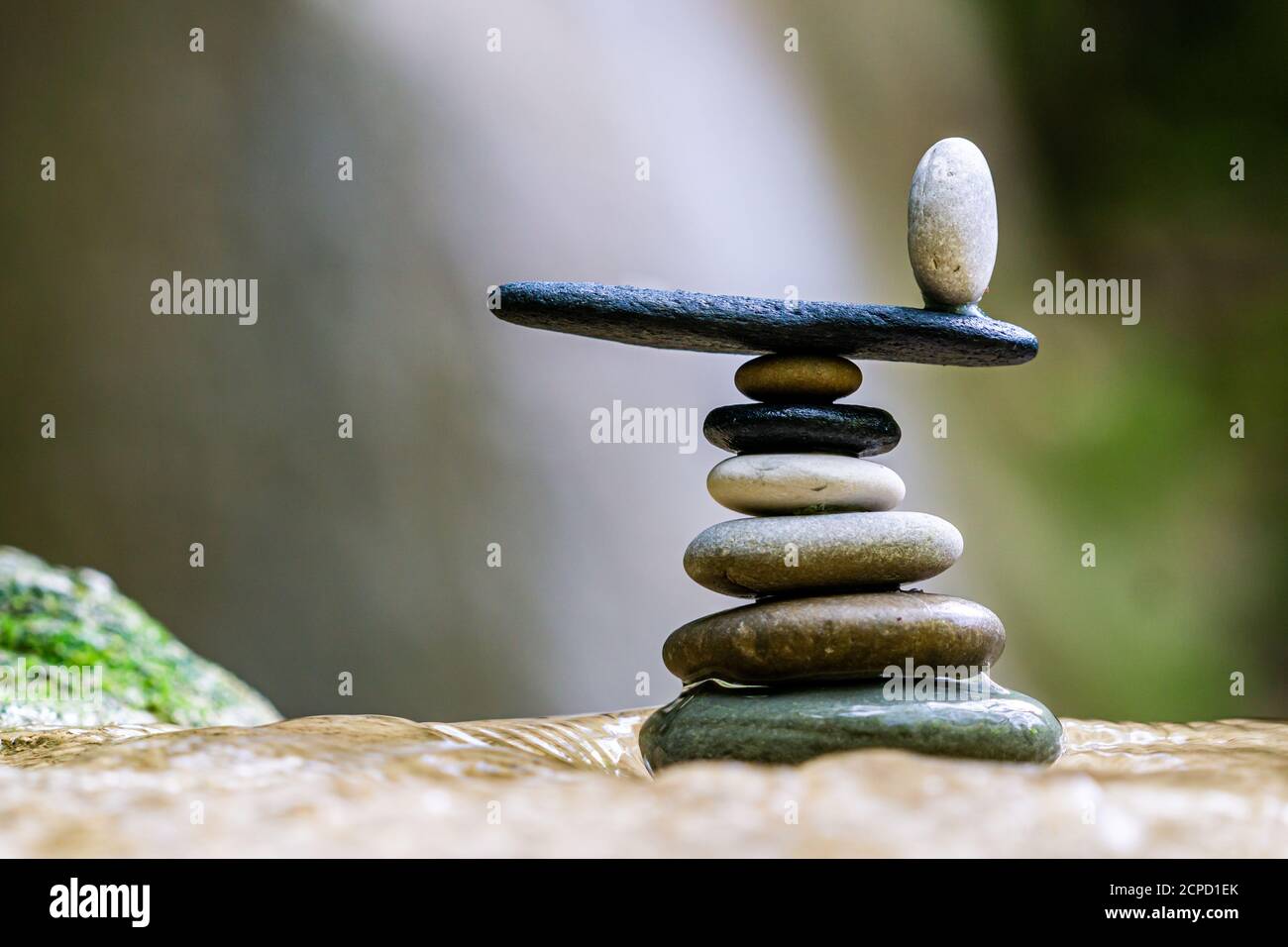 Balanced Zen stones pebbles at the waterfalls Stock Photo - Alamy