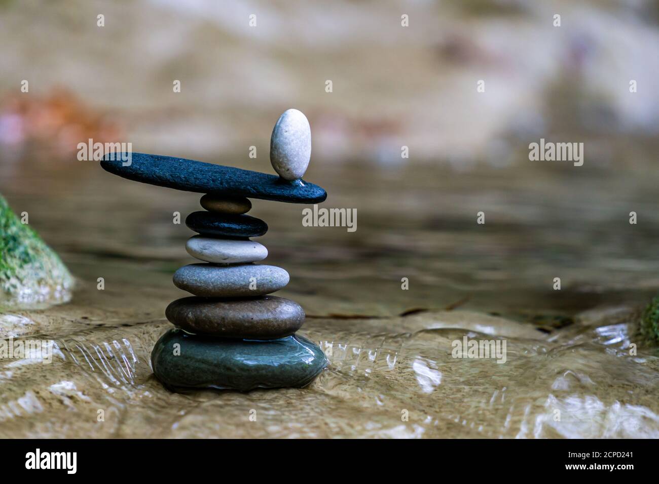 Balanced Zen stones pebbles at the waterfalls Stock Photo - Alamy