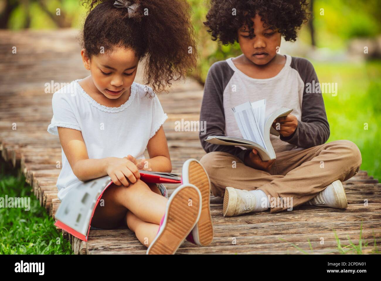 Two Kids Reading Together