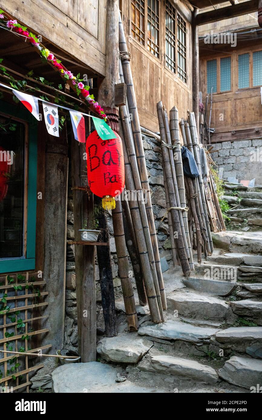 Narrow stone steps wind between traditional homes in Ping'an Stock ...