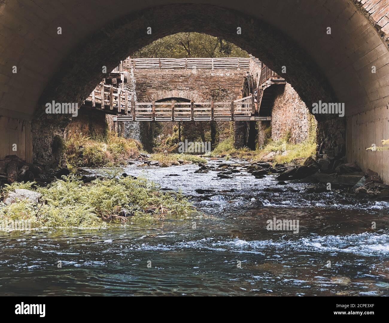 Big obsolete bridge over the river Stock Photo - Alamy