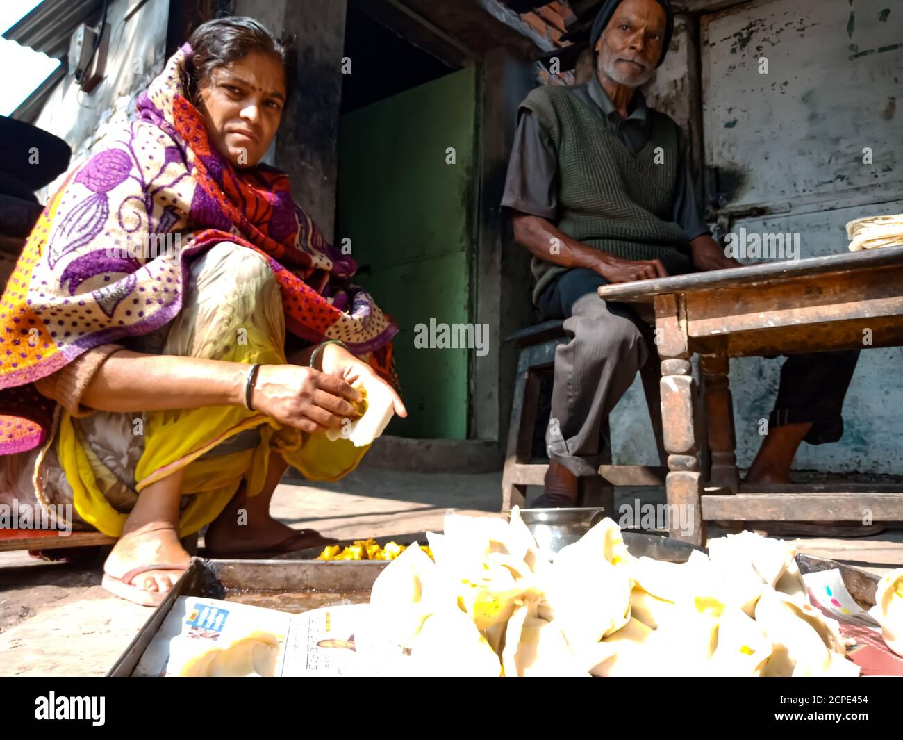 DISTRICT KATNI, INDIA - JANUARY 08, 2020: An asian old lady making ...