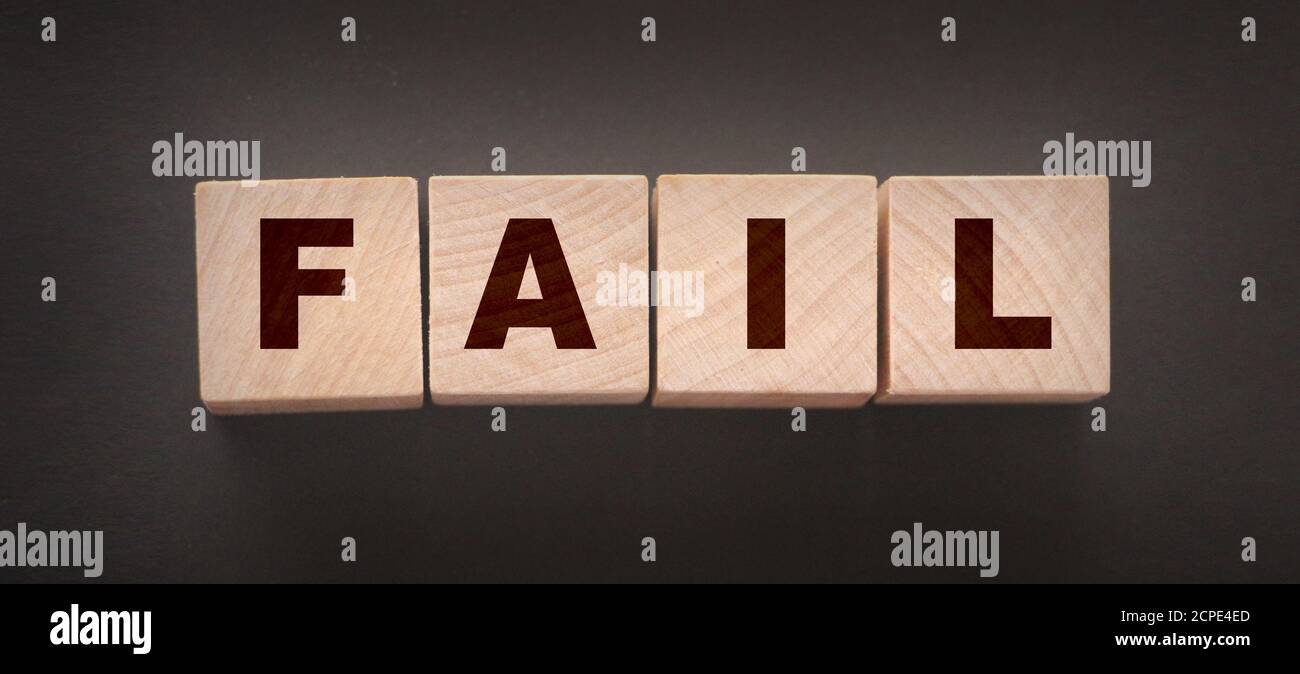 FAIL Word text Written In Wooden Cube blocks on black background ...