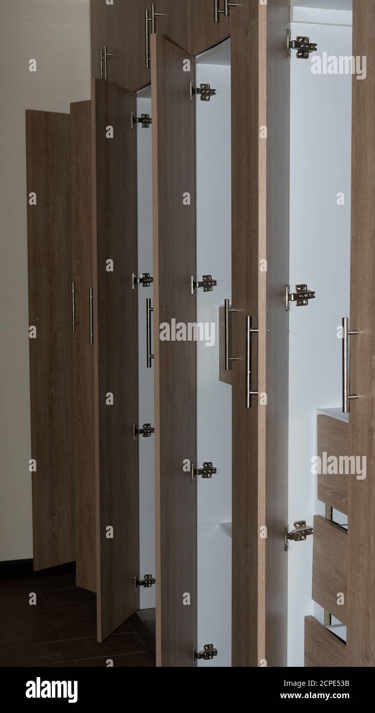 Empty open wooden wardrobe Stock Photo - Alamy
