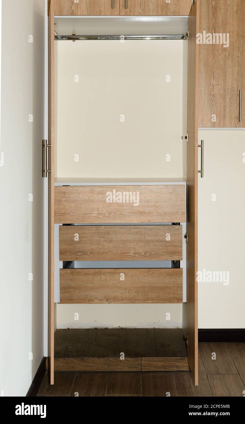Empty open wooden wardrobe Stock Photo - Alamy