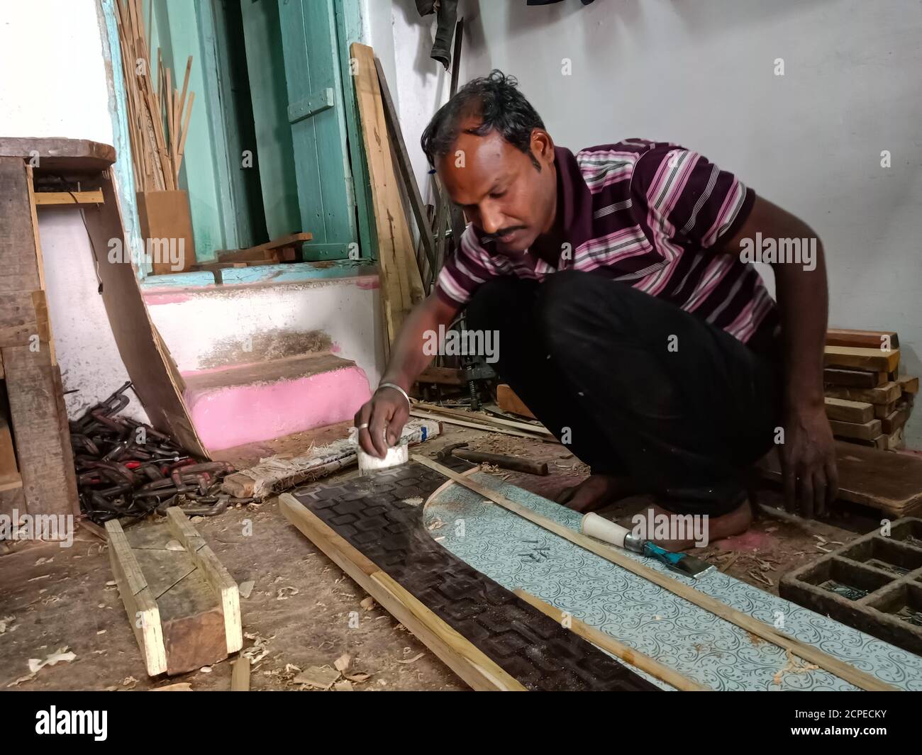 DISTRICT KATNI, INDIA - JANUARY 08, 2020: An indian wooden artist ...