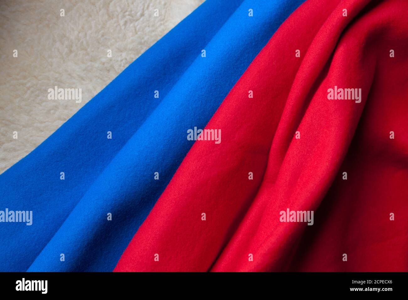 Background texture of red and blue fleece, soft napped insulating ...