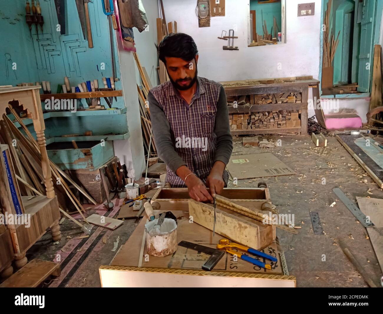 DISTRICT KATNI, INDIA - JANUARY 08, 2020: An indian male wooden artist ...