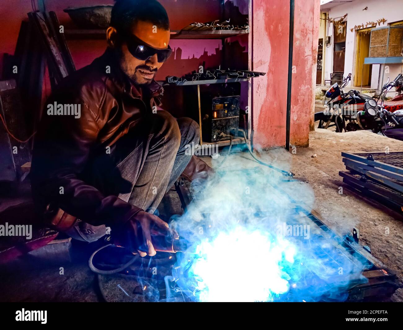 DISTRICT KATNI, INDIA - JANUARY 08, 2020: An indian blacksmith welding ...