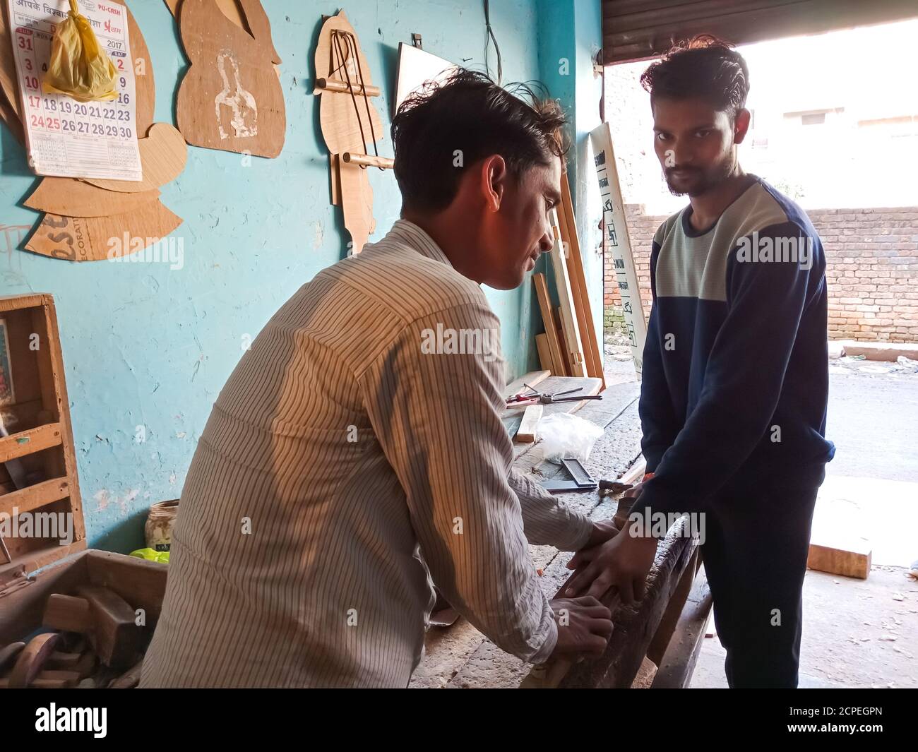 DISTRICT KATNI, INDIA - JANUARY 08, 2020: Two indian woodworkers ...