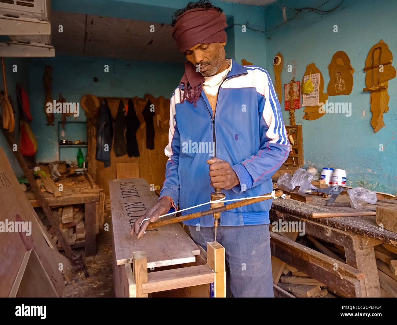 DISTRICT KATNI, INDIA - JANUARY 08, 2020: An asian saw factory worker ...