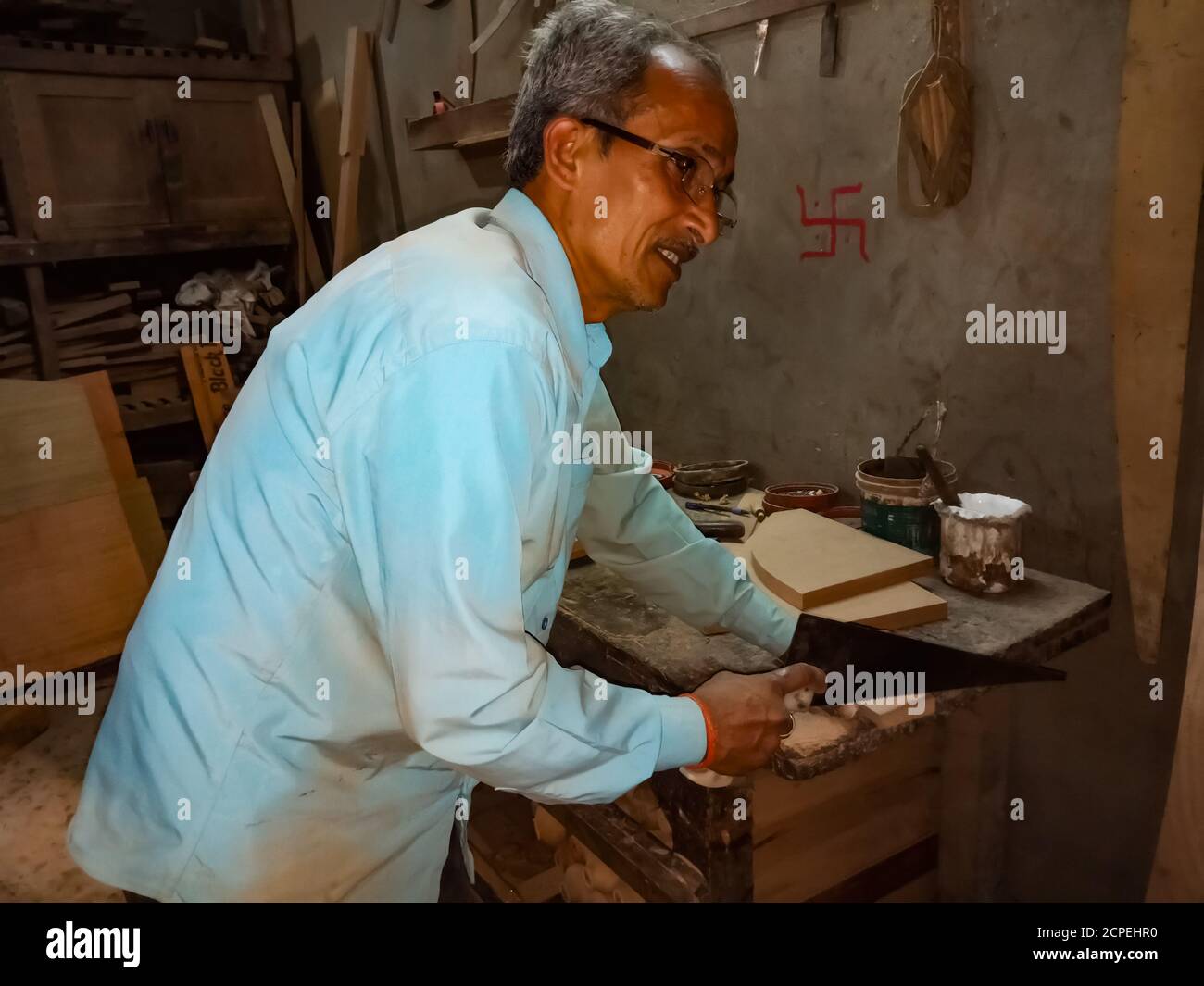 DISTRICT KATNI, INDIA - JANUARY 08, 2020: An indian saw factory worker ...
