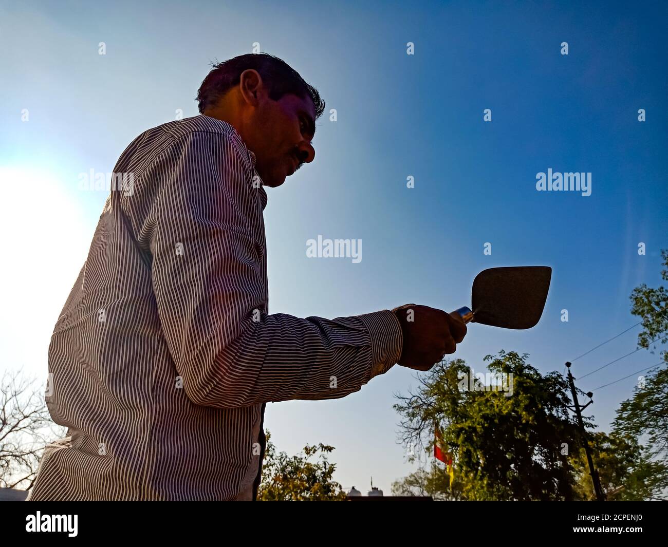 DISTRICT KATNI, INDIA - JANUARY 13, 2020: An indian male labour holded ...