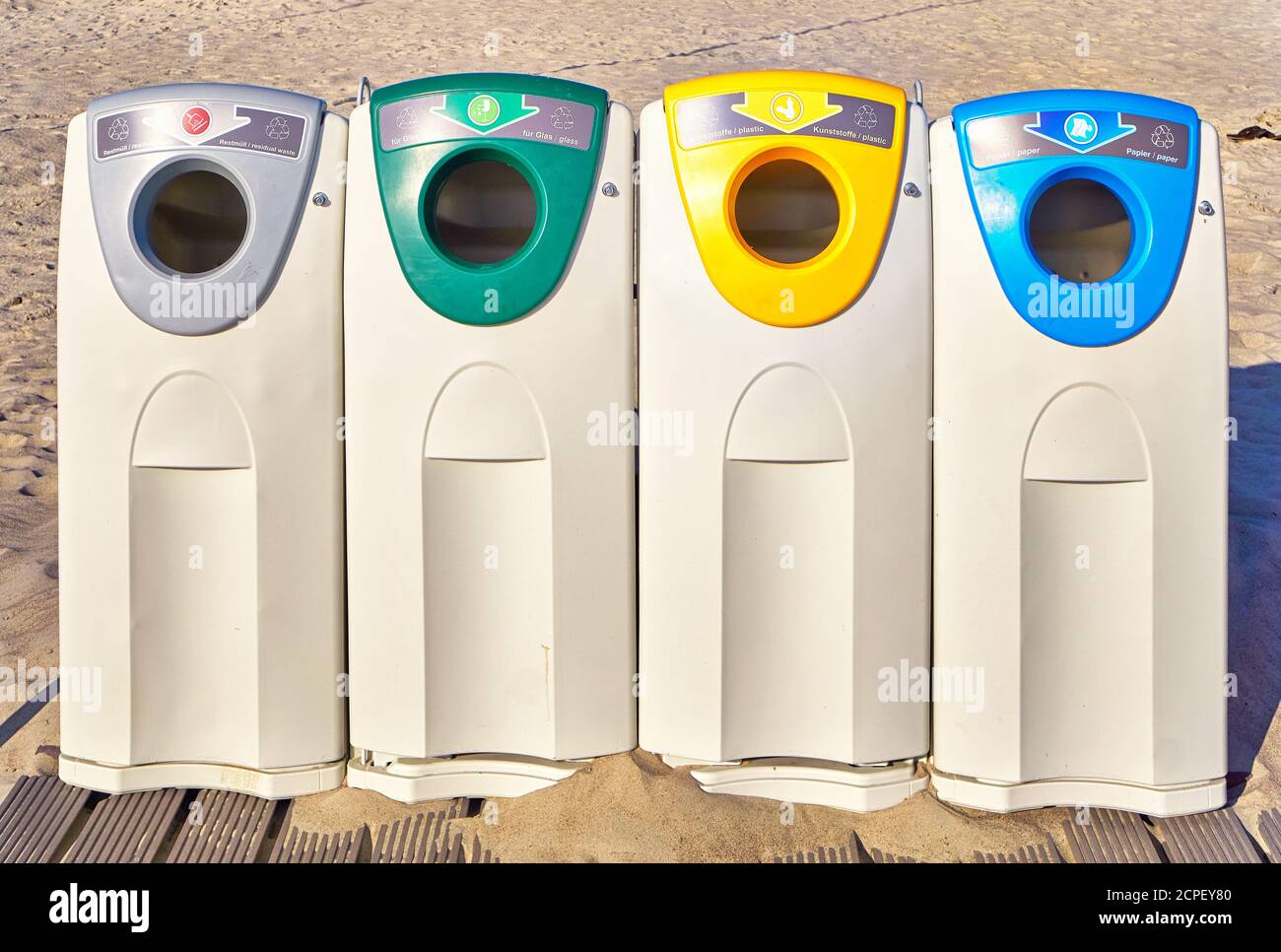 Modern garbage sorting containers on a public beach with a new ...