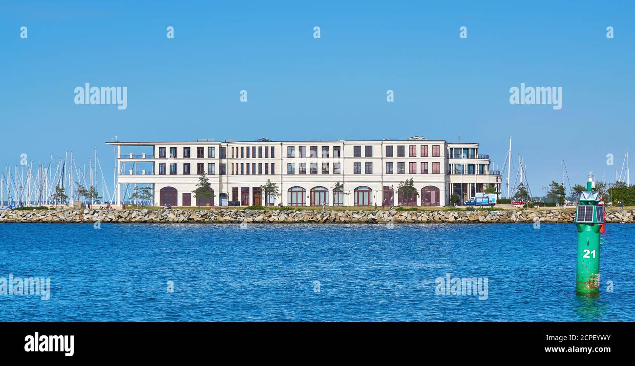 Modern apartment building on the Baltic Sea stone pier next to the ...