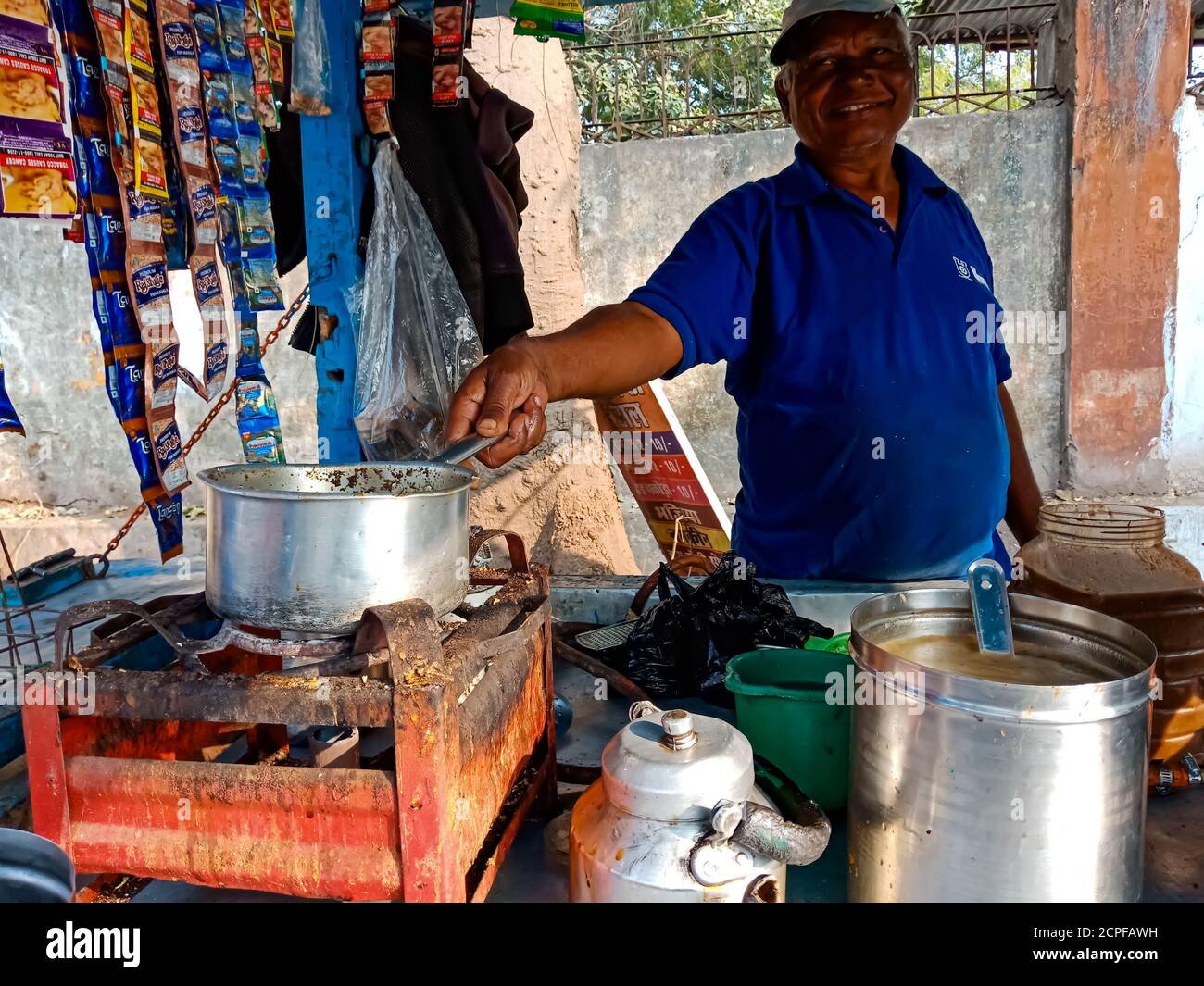 DISTRICT KATNI, INDIA - JANUARY 18, 2020: An indian man making tea from ...