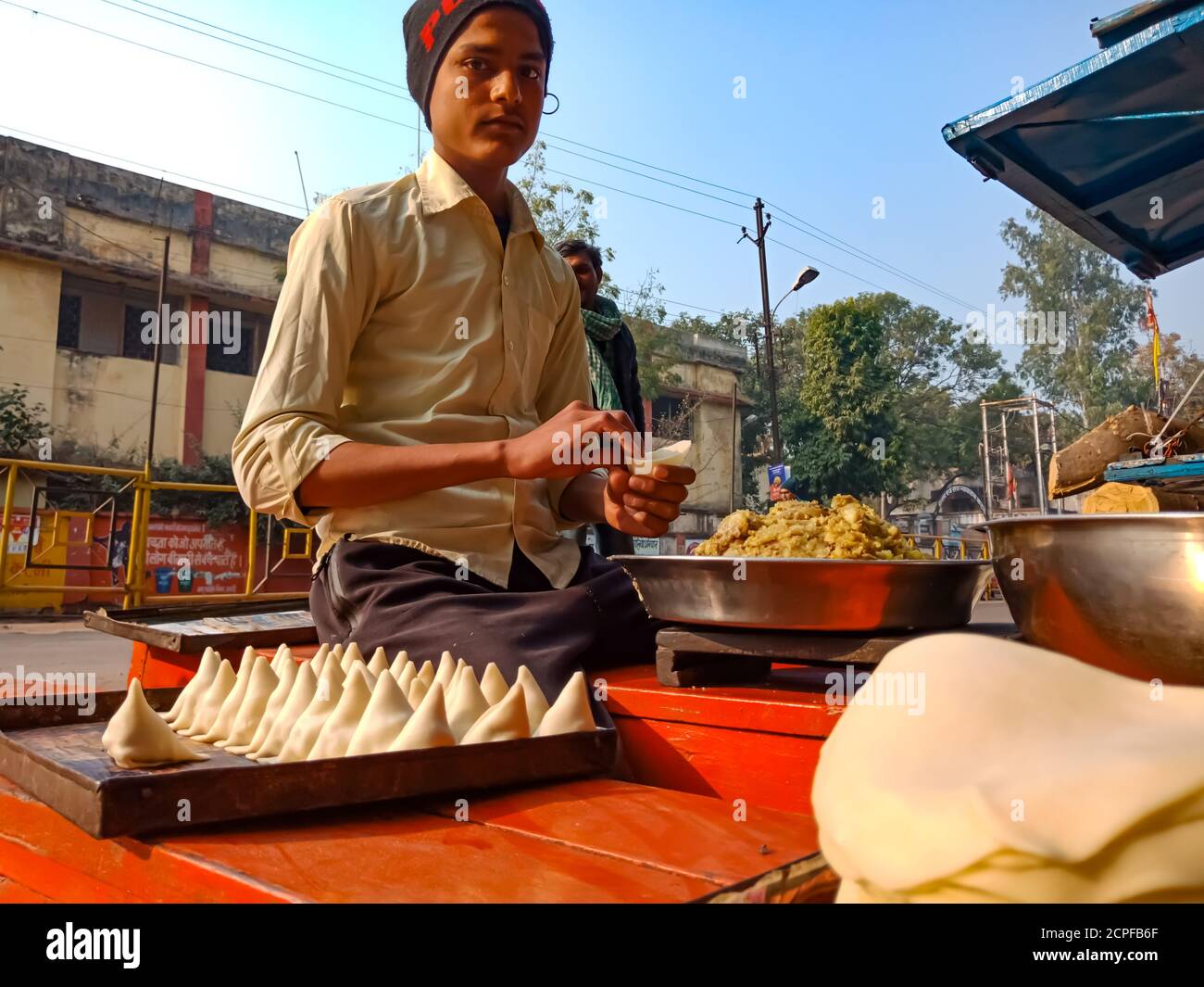 DISTRICT KATNI, INDIA - JANUARY 18, 2020: An indian boy making samosa ...