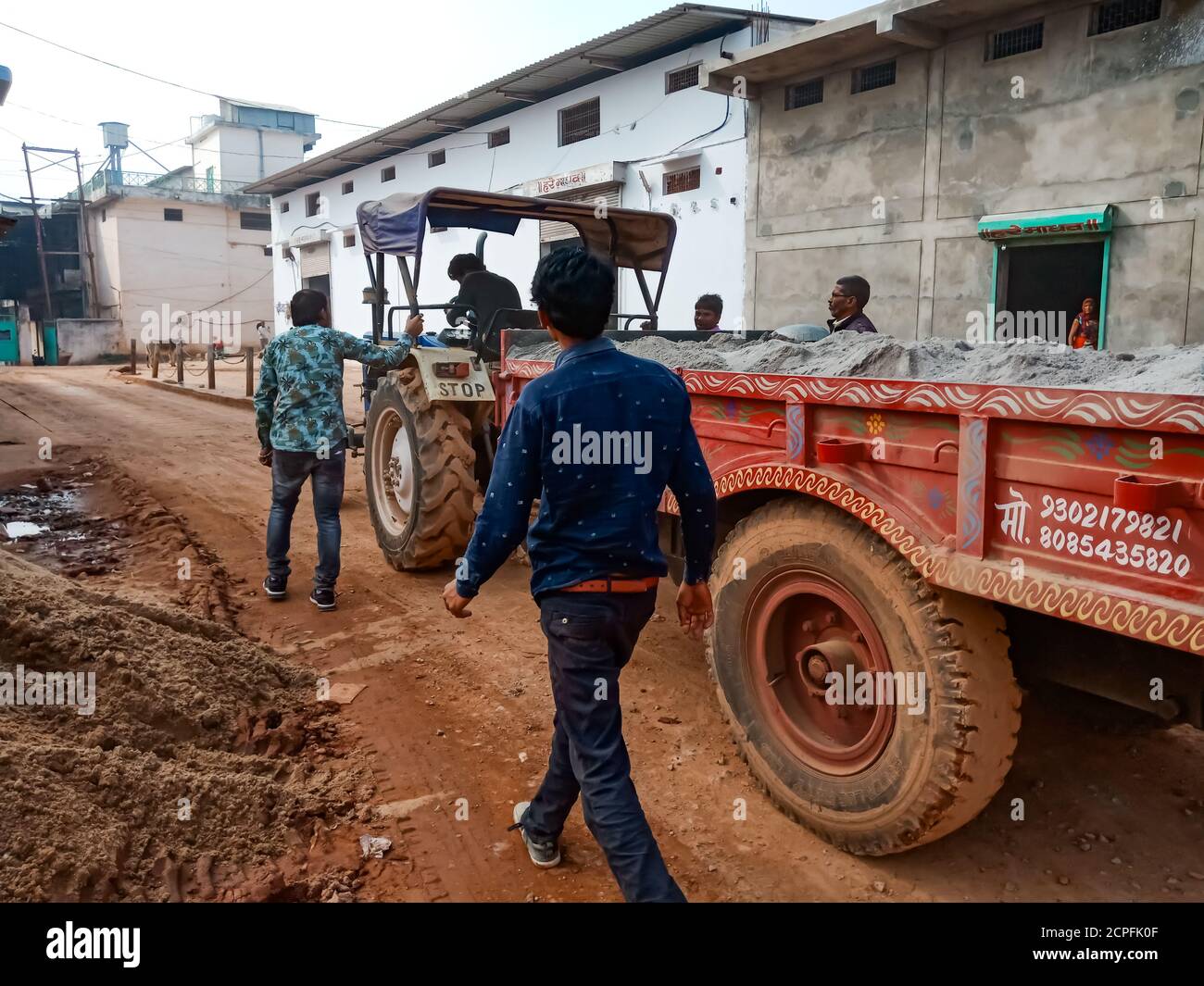 DISTRICT KATNI, INDIA - JANUARY 18, 2020: Indian local people pushing ...