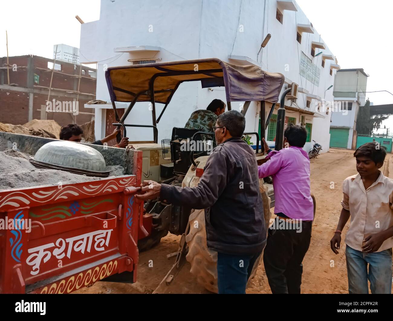 DISTRICT KATNI, INDIA - JANUARY 18, 2020: Indian local people pushing ...