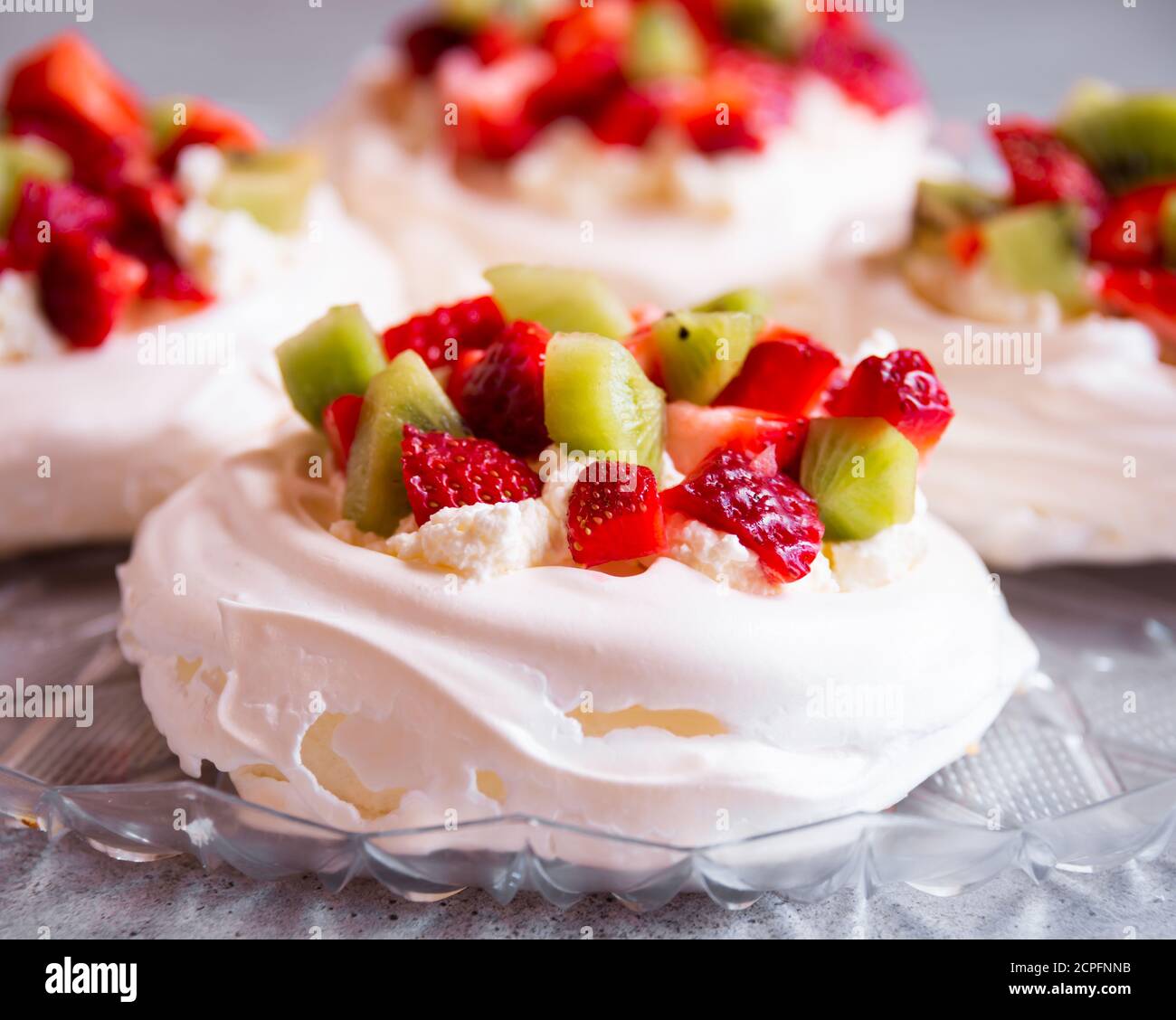 Delicious Pavlova cake with meringue and fresh fruit Stock Photo - Alamy