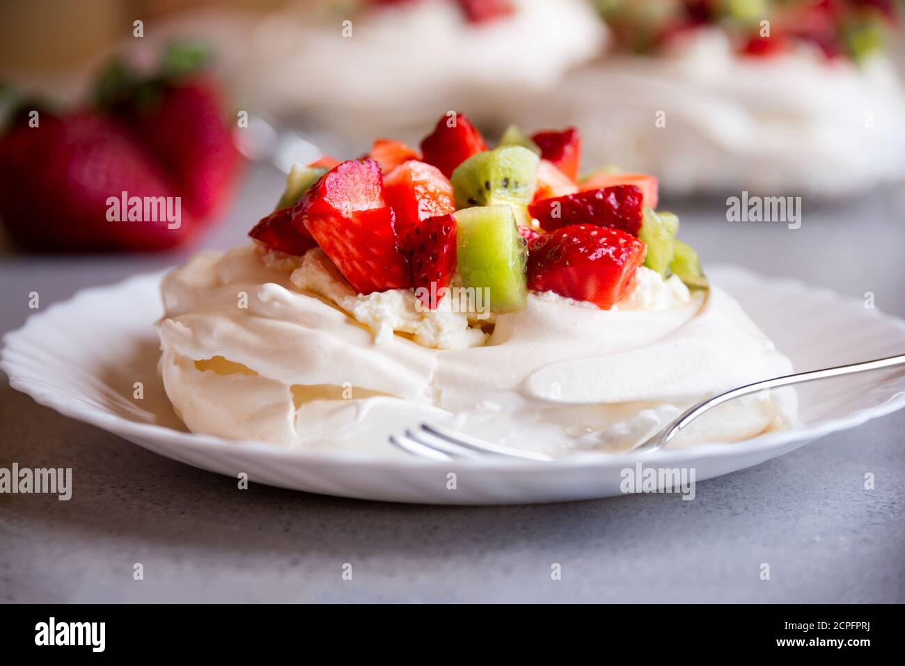 Delicious Pavlova cake with meringue and fresh fruit Stock Photo - Alamy