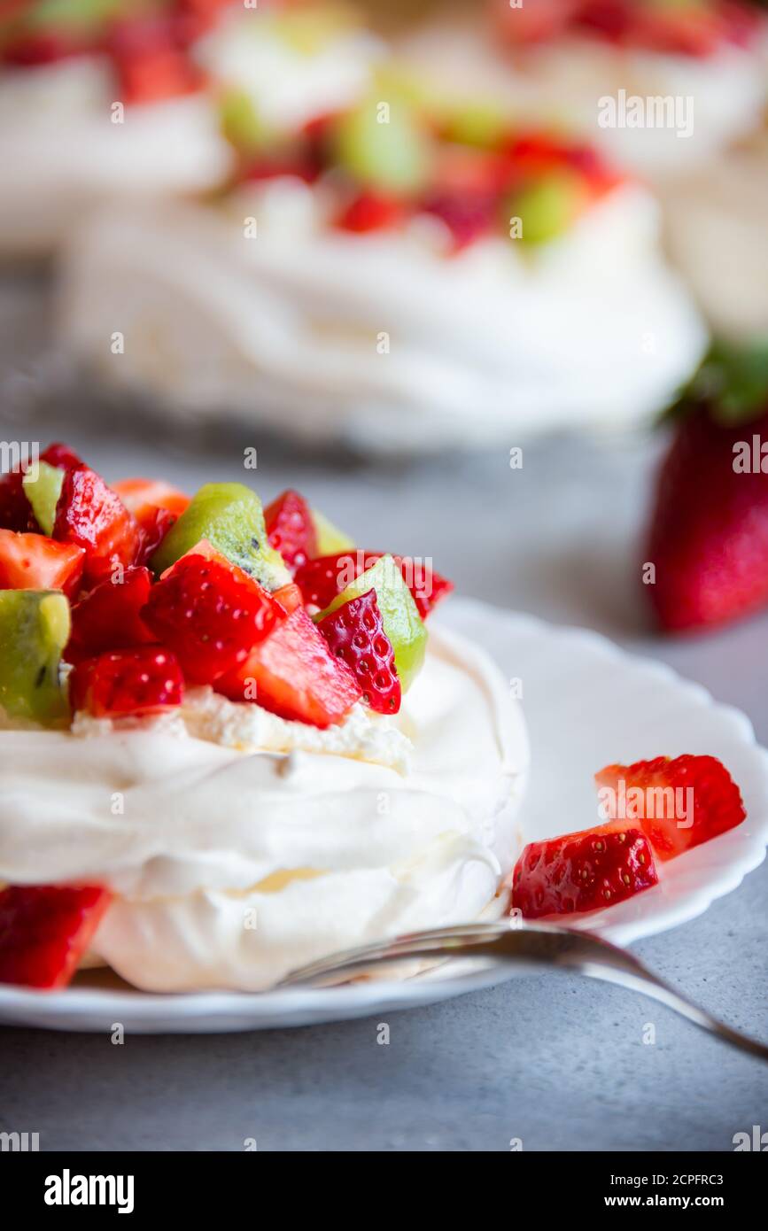 Delicious Pavlova cake with meringue and fresh fruit Stock Photo - Alamy