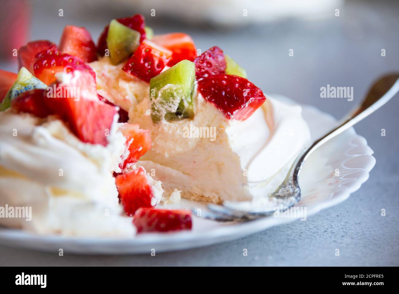 Delicious Pavlova cake with meringue and fresh fruit Stock Photo - Alamy