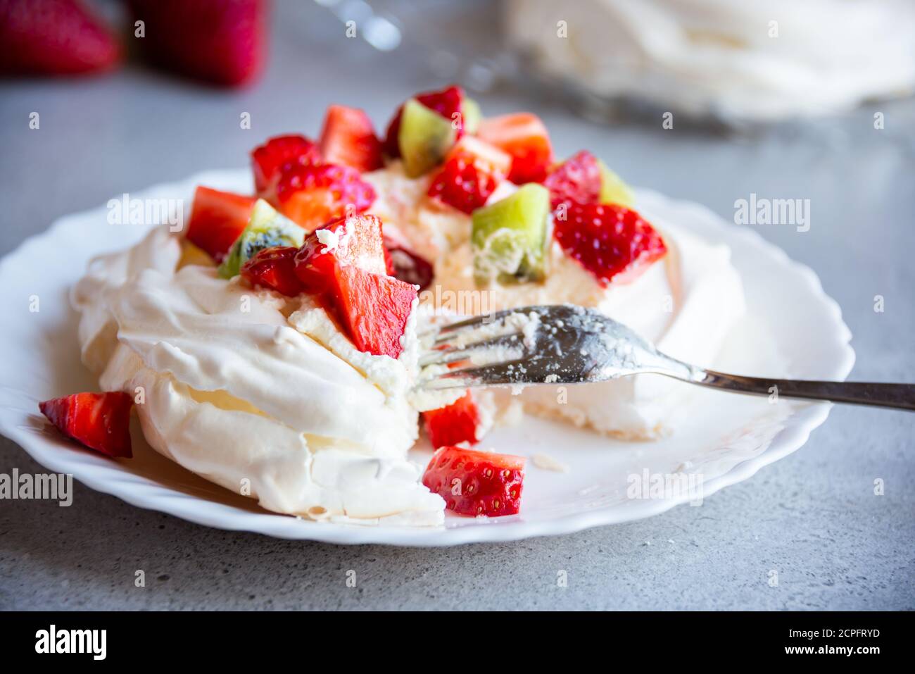 Delicious Pavlova cake with meringue and fresh fruit Stock Photo - Alamy