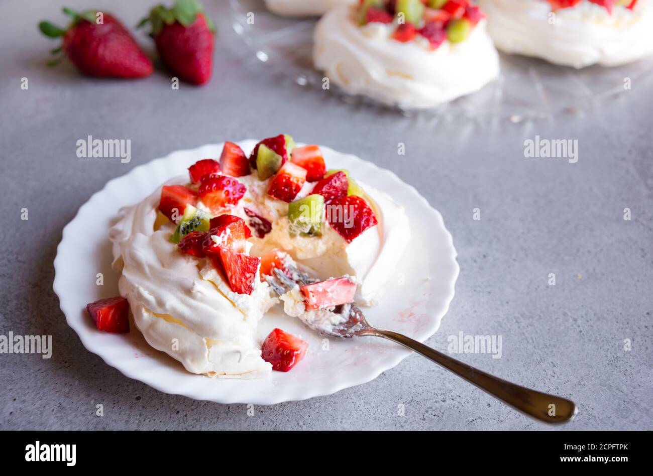 Delicious Pavlova cake with meringue and fresh fruit Stock Photo - Alamy