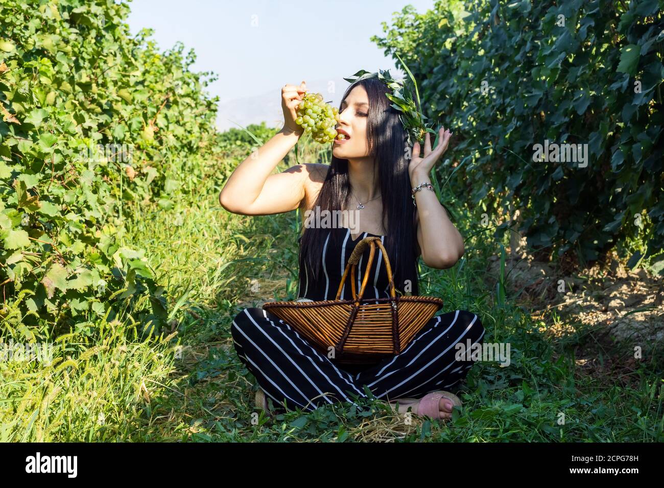 Woman eating grapes hi-res stock photography and images - Alamy