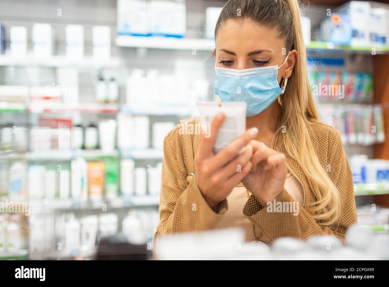Female customer checking pharmaceutical products hi-res stock ...