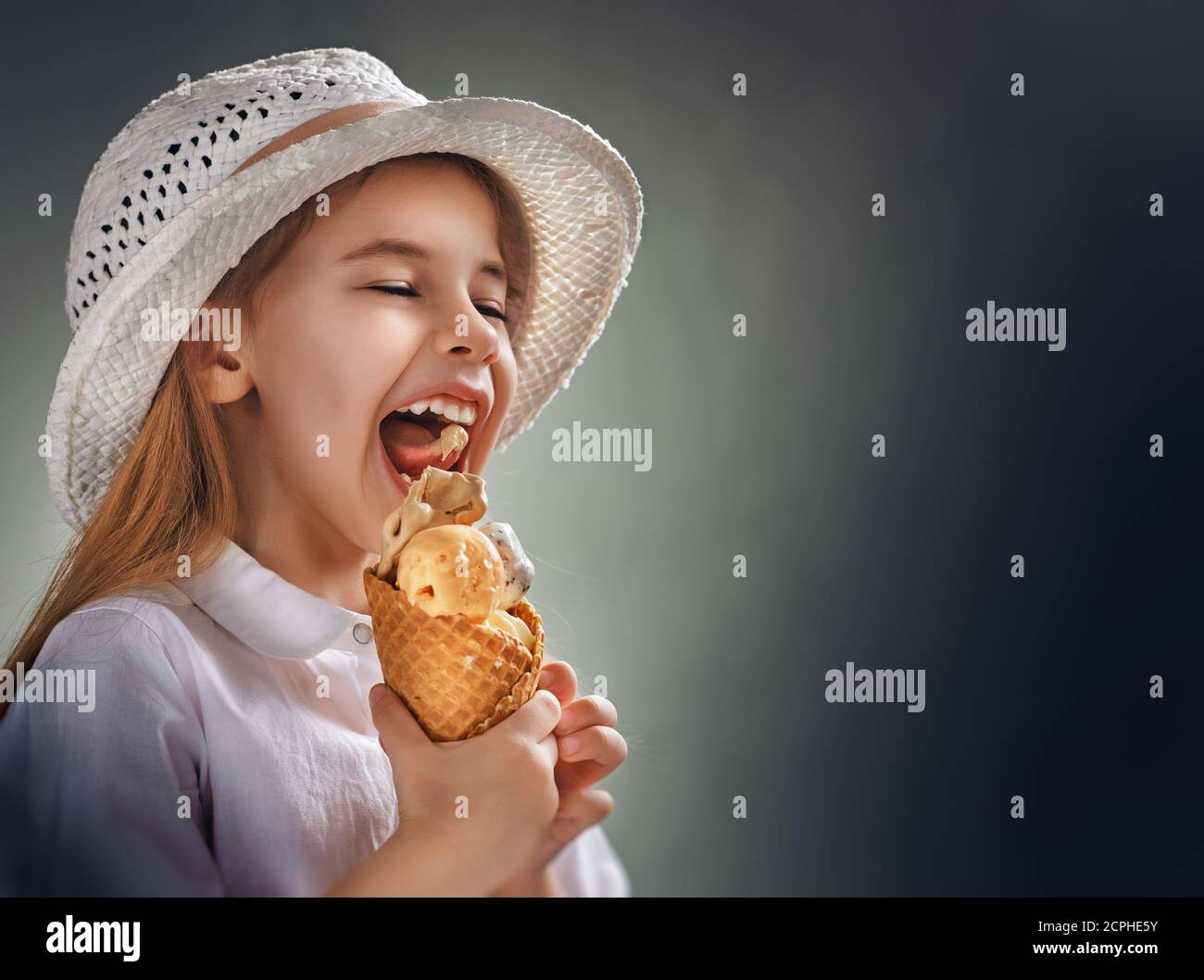 little girl eating ice cream Stock Photo - Alamy