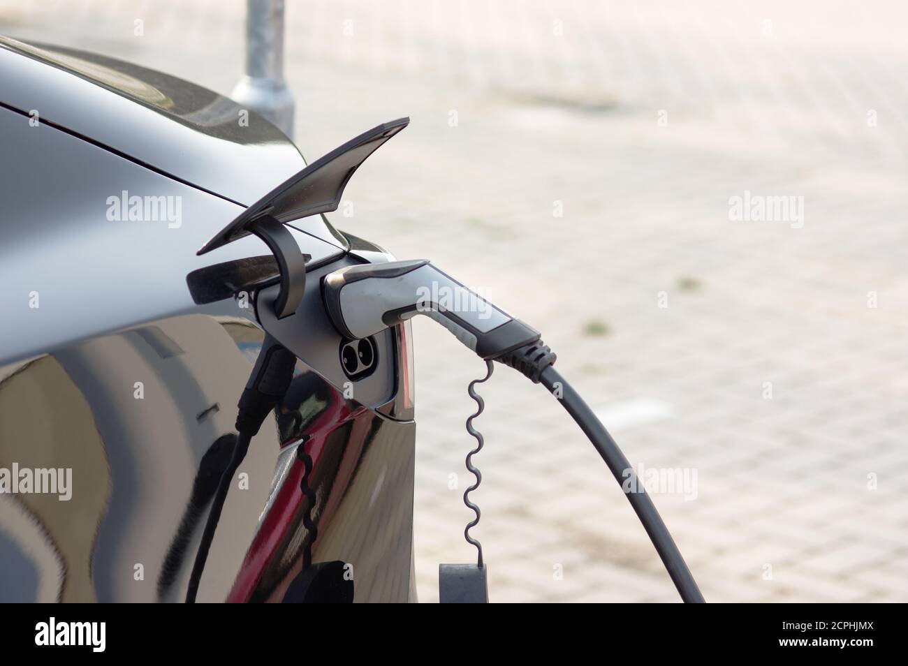 Power plug of a electric car with the charger cable attached Stock ...