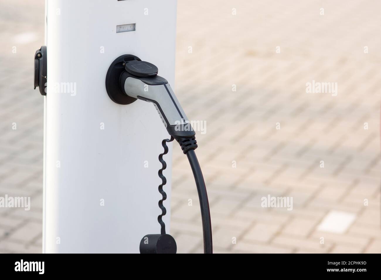 Electric charging station with a connected power cable Stock Photo - Alamy
