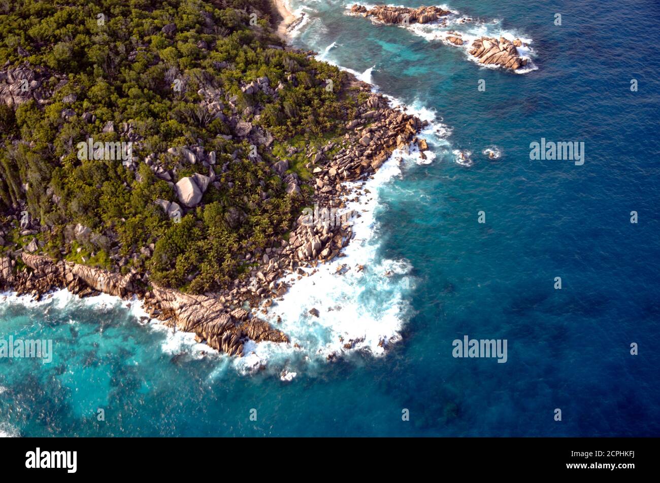Aerial view of a tropical island with coastline and blue ocean. La ...