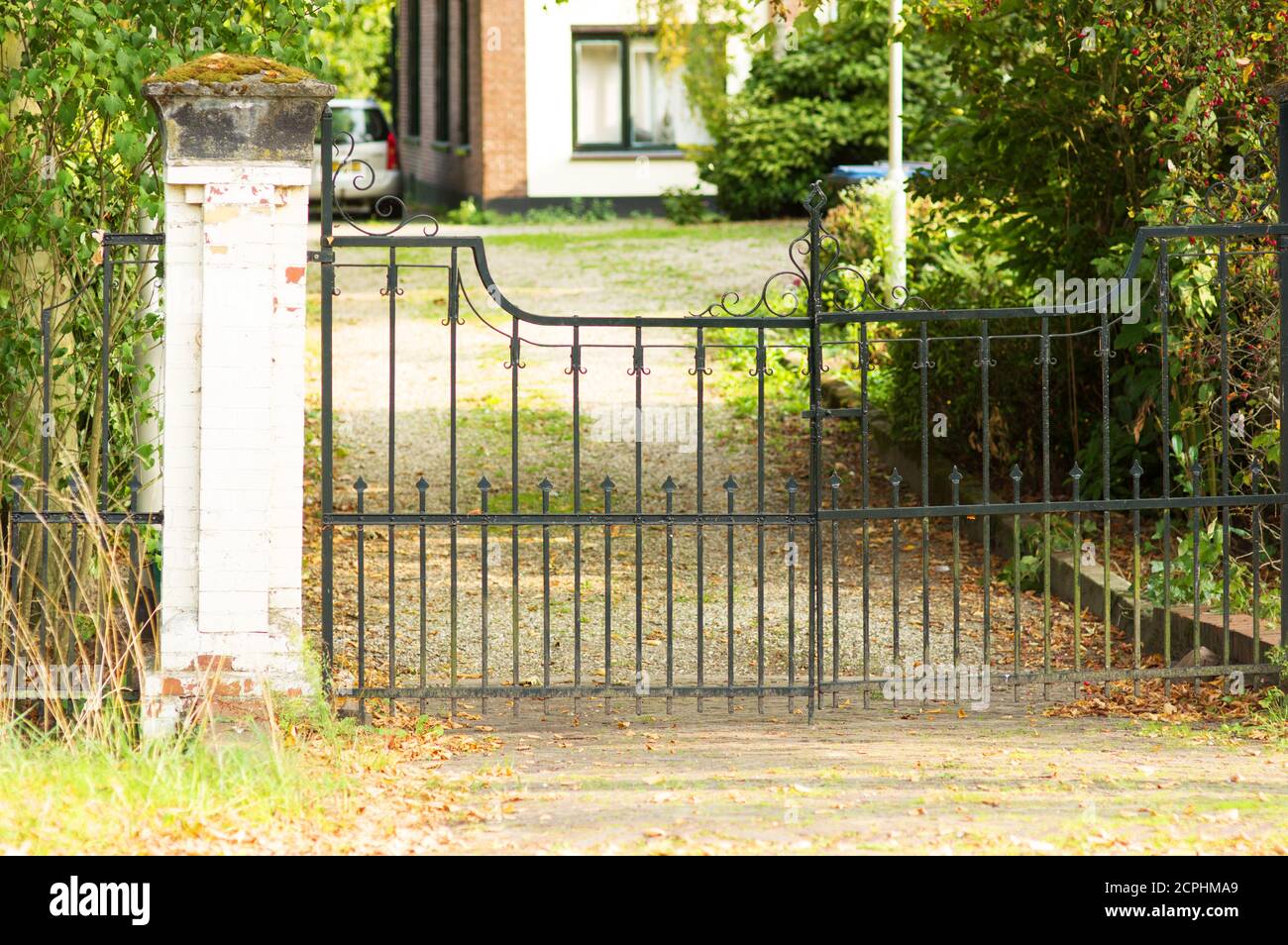 Ancient steel closed gate that gives access to a house Stock Photo - Alamy