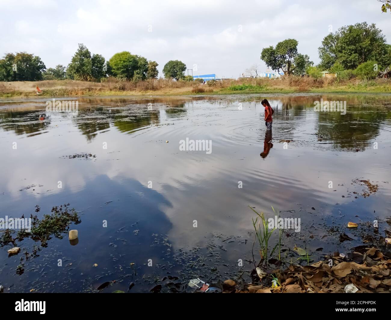 DISTRICT KATNI, INDIA - JANUARY 01, 2020: Asian village kid entering ...
