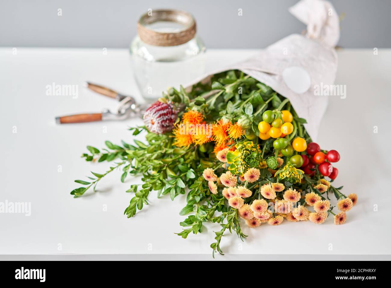 Series, step by step installation of flowers in a vase. Flowers bunch ...