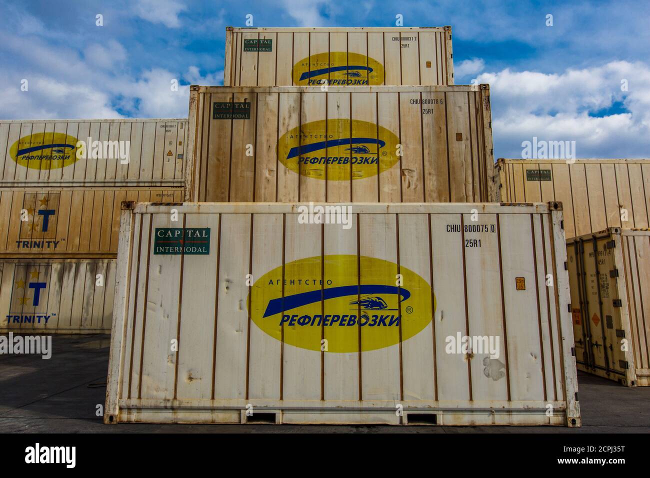 Container terminal. Metal containers stand in straight rows in an open ...