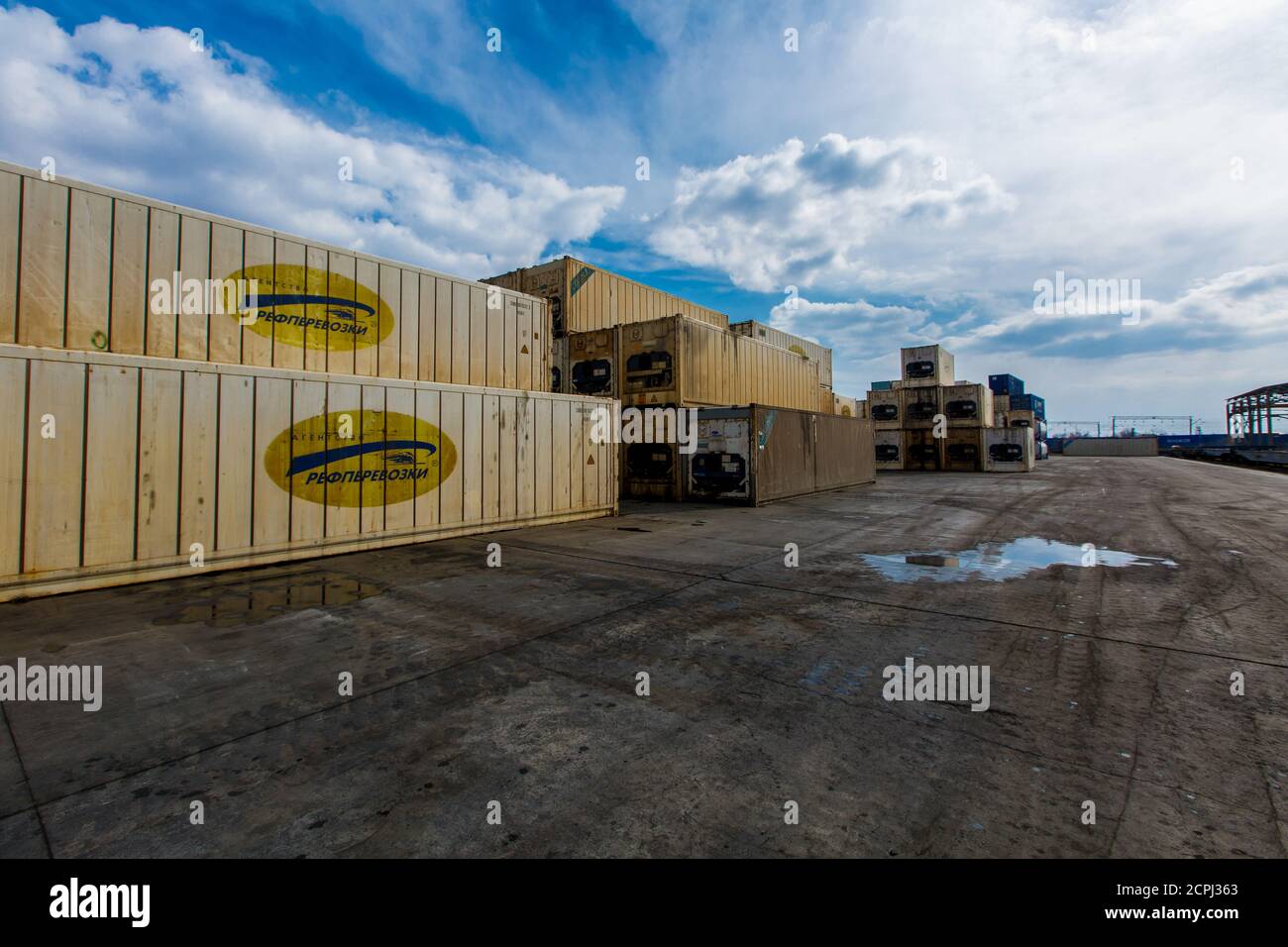 Container terminal. Metal containers stand in straight rows in an open ...
