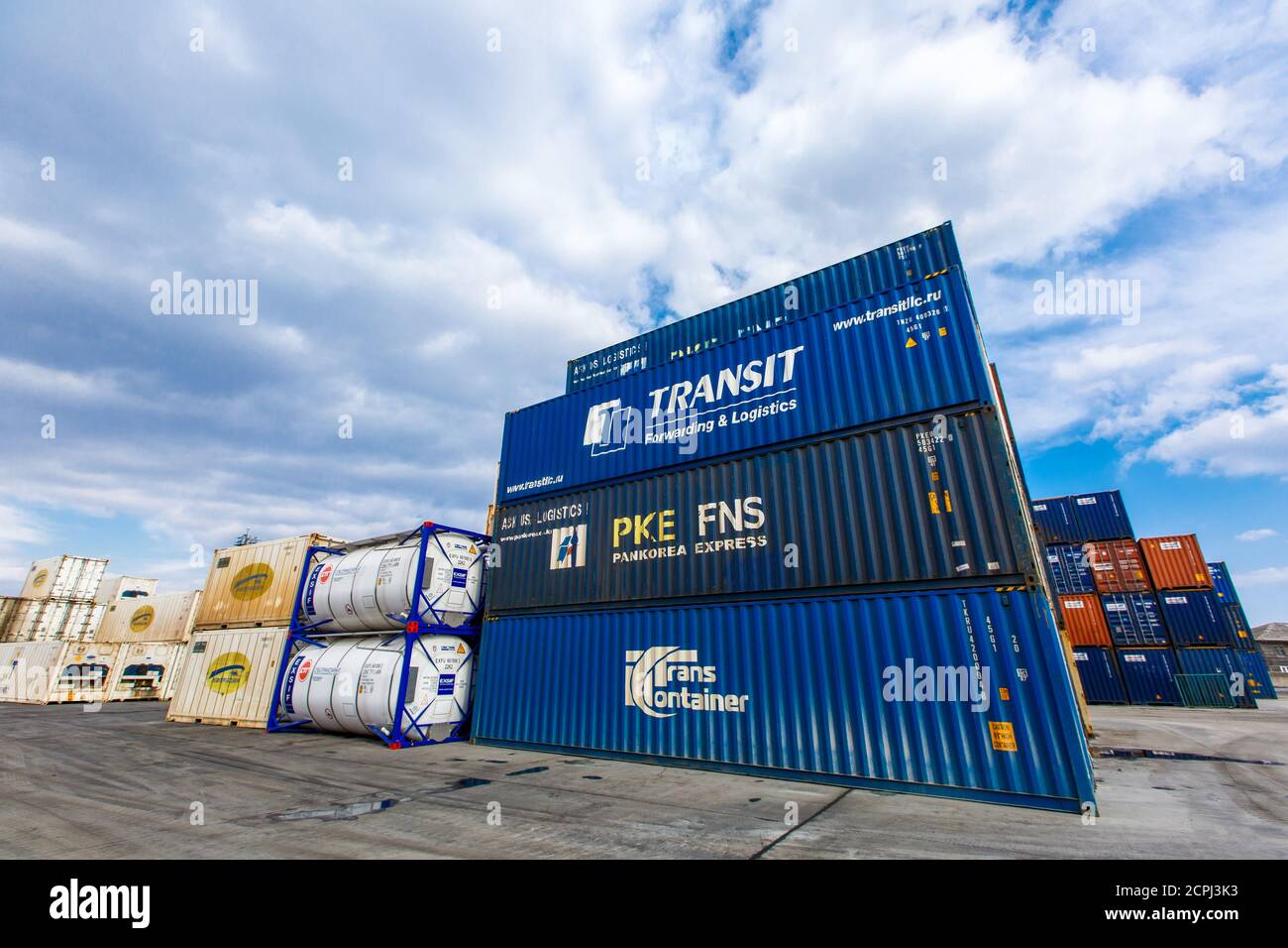 Container terminal. Metal containers stand in straight rows in an open ...