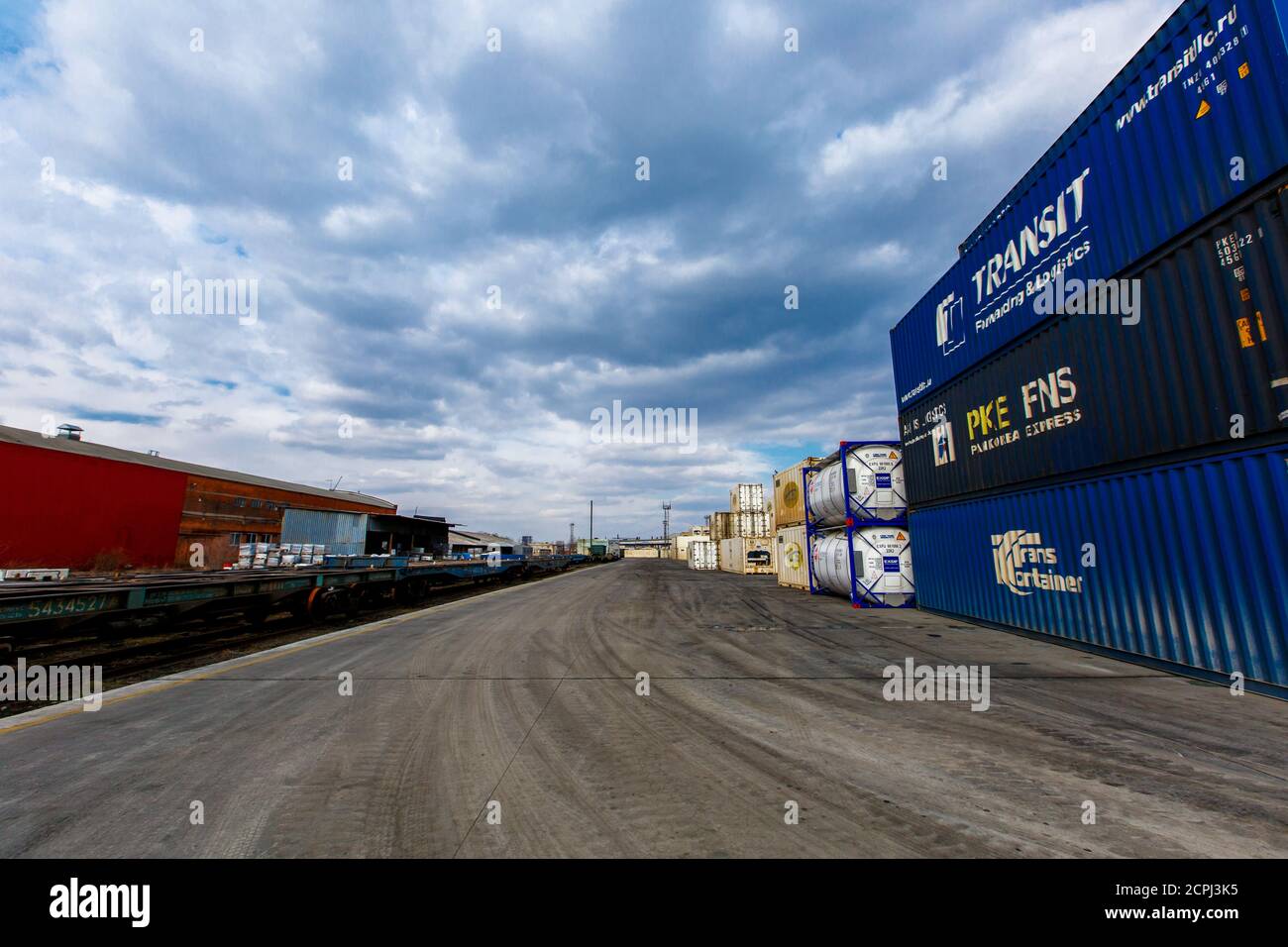 Container terminal. Metal containers stand in straight rows in an open ...