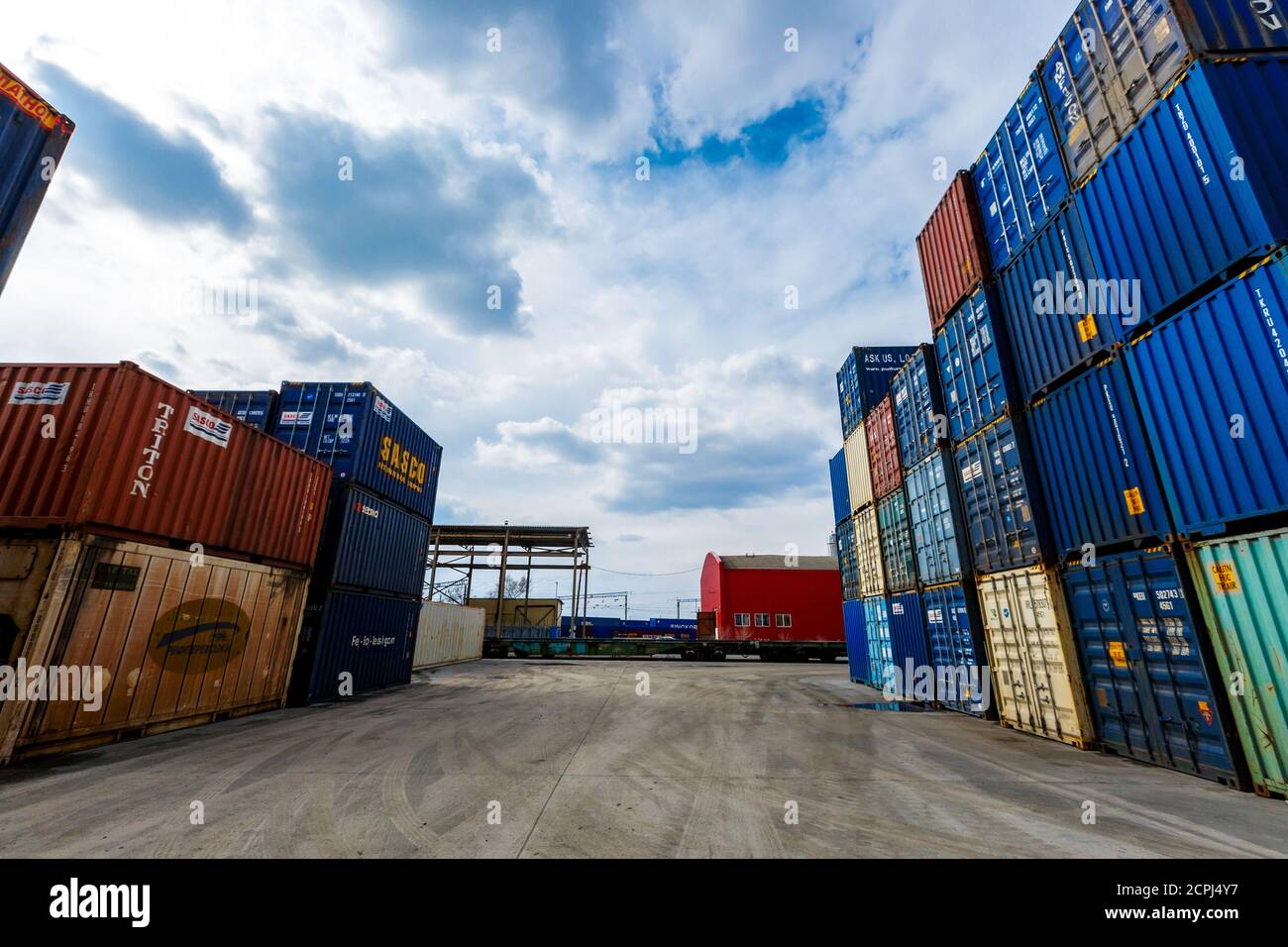 Container terminal. Metal containers stand in straight rows in an open ...