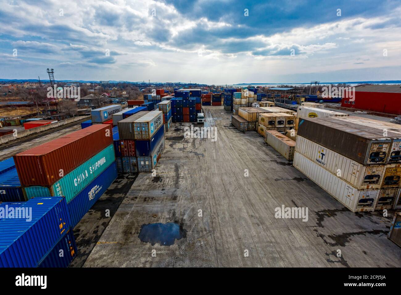 Container terminal. Metal containers stand in straight rows in an open ...