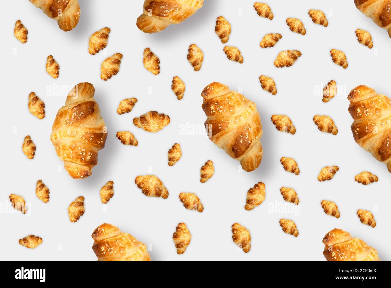 Pattern French croissant on a light background Stock Photo - Alamy