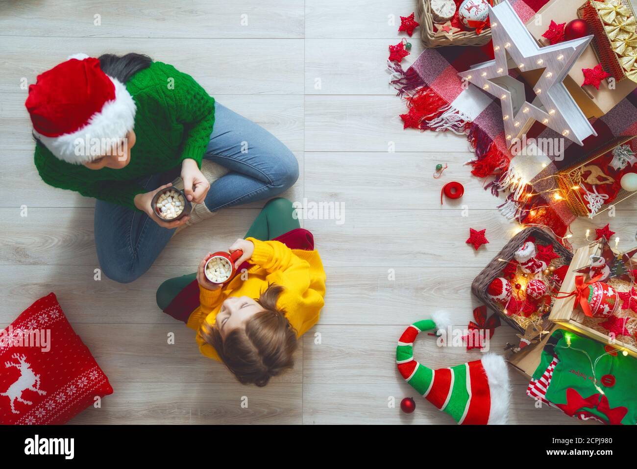 Happy family preparing for Christmas. Mother and her daughter ...