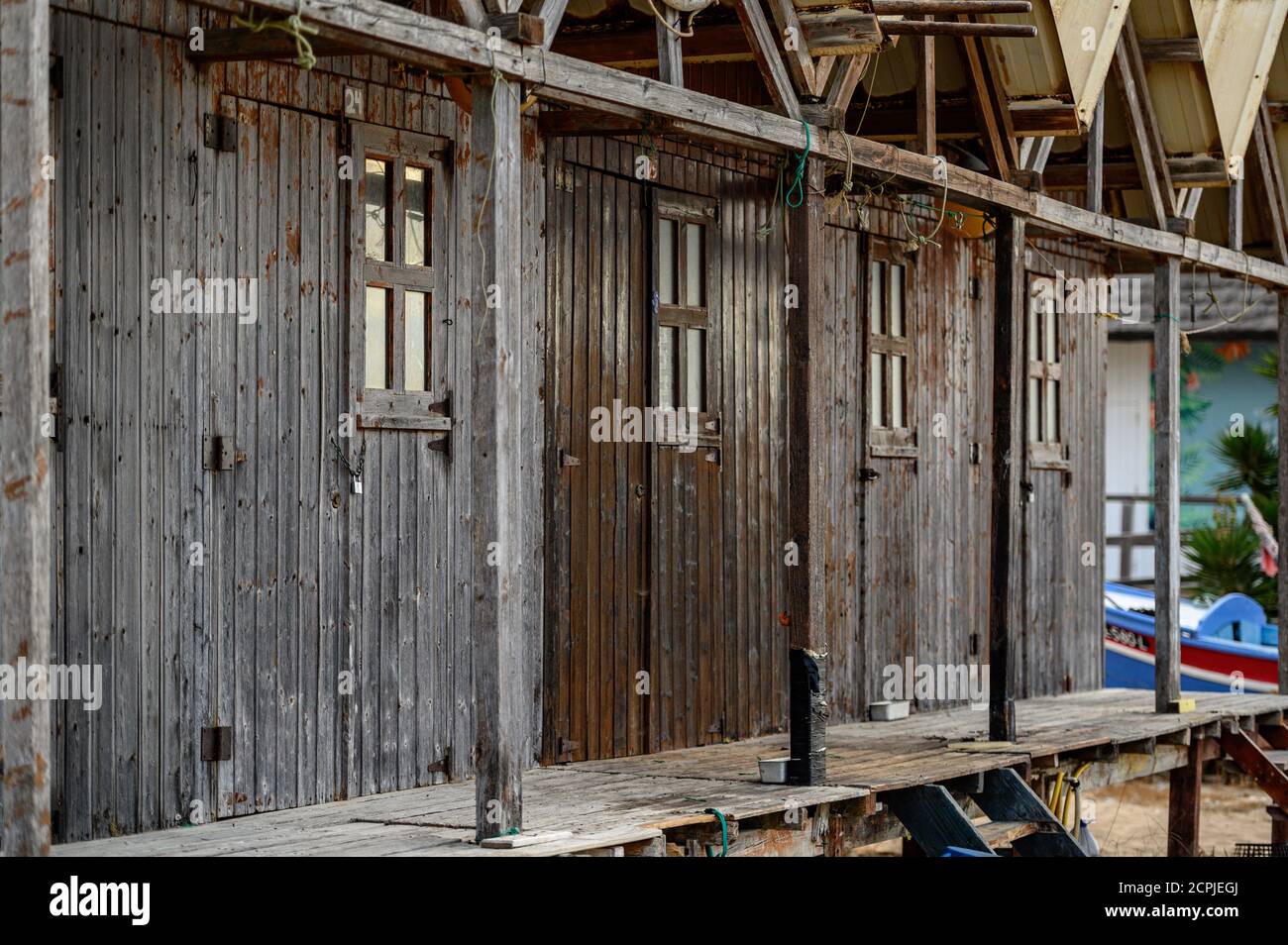 Row of old wooden huts in a coast Stock Photo - Alamy