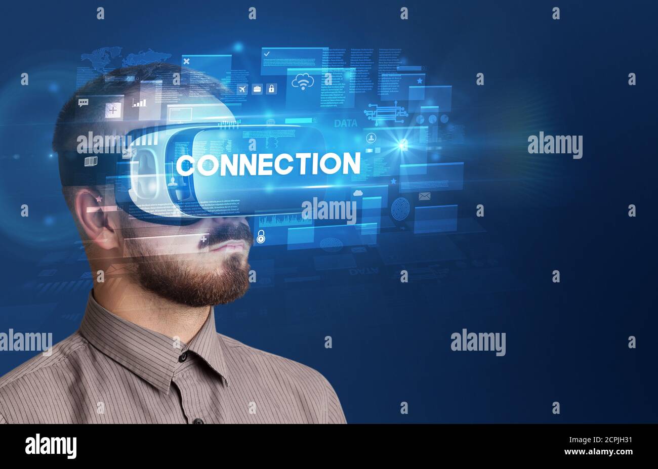 Businessman looking through Virtual Reality glasses with CONNECTION ...