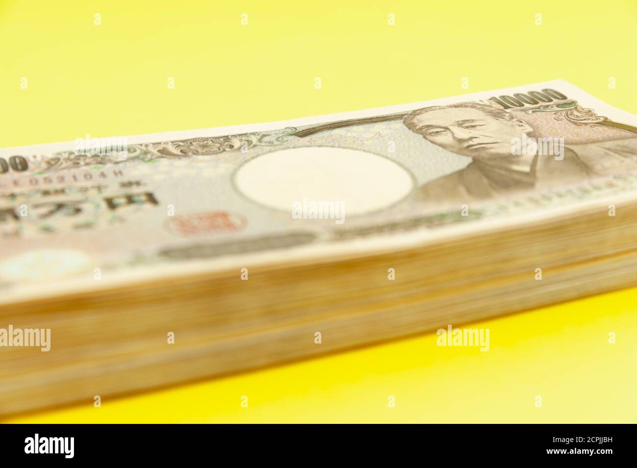 Ten thousand yen (10,000 yen) banknotes stacked. Japanese money. Paper ...