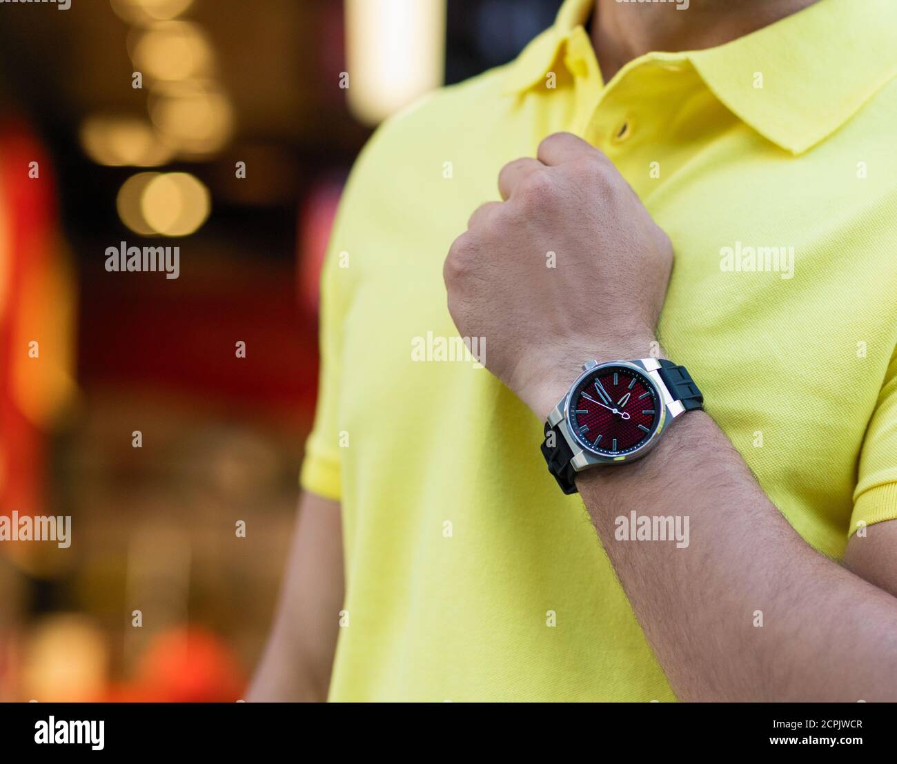 Luxury sport hand watch yellow worn man close up Stock Photo - Alamy